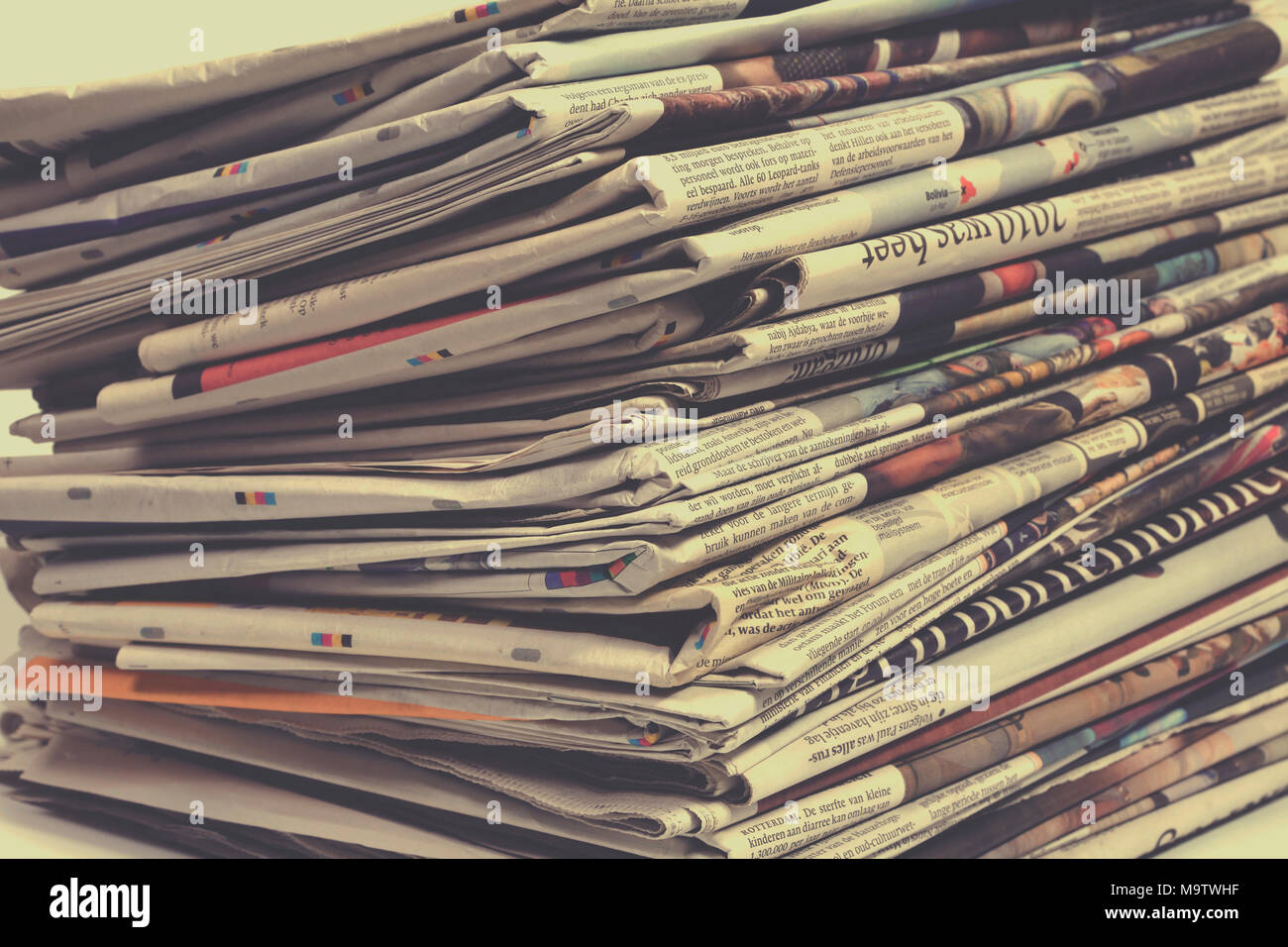 Stack of newspapers Stock Photo - Alamy