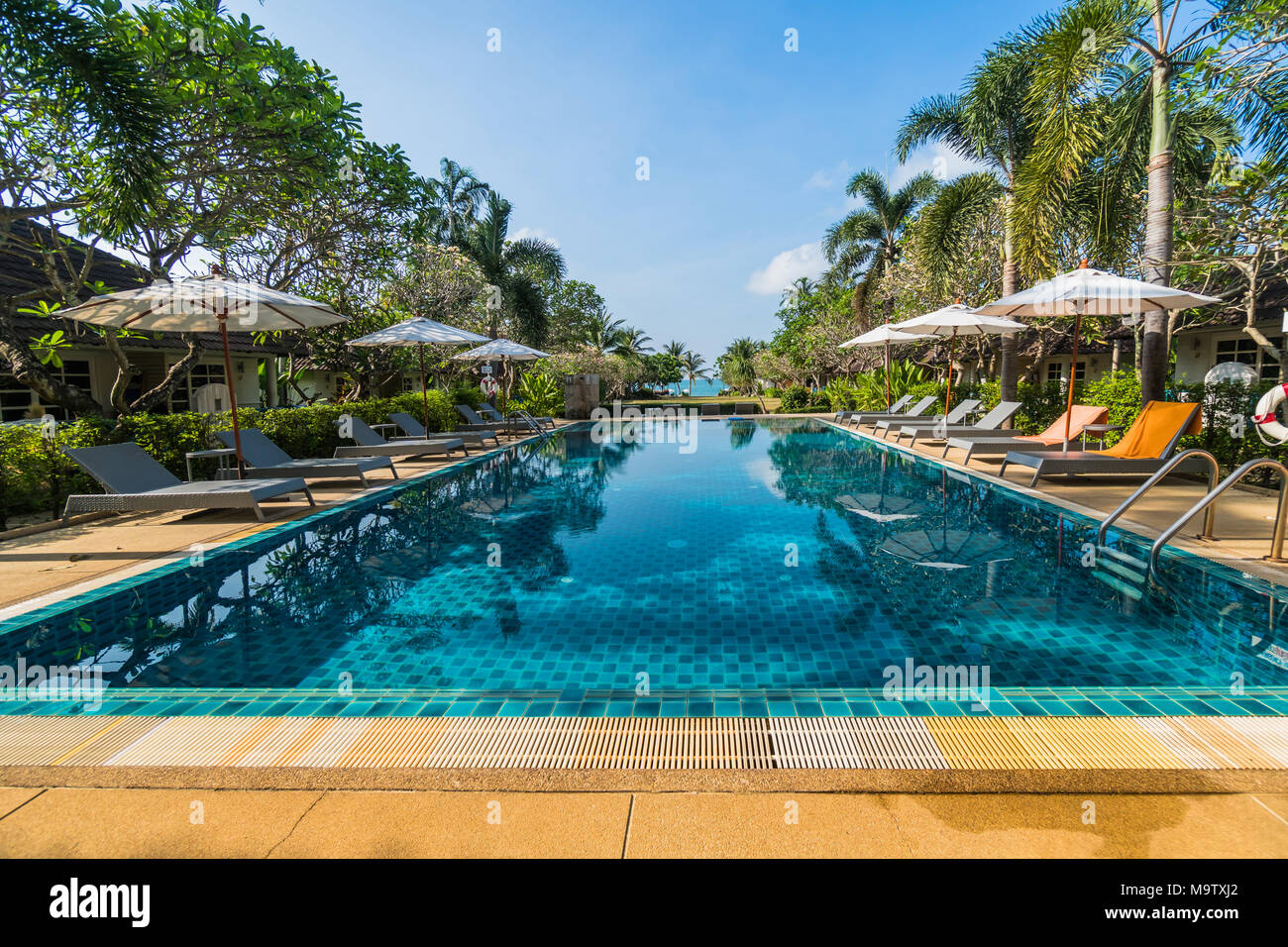 Beautiful luxury swimming pool in hotel resort Stock Photo - Alamy