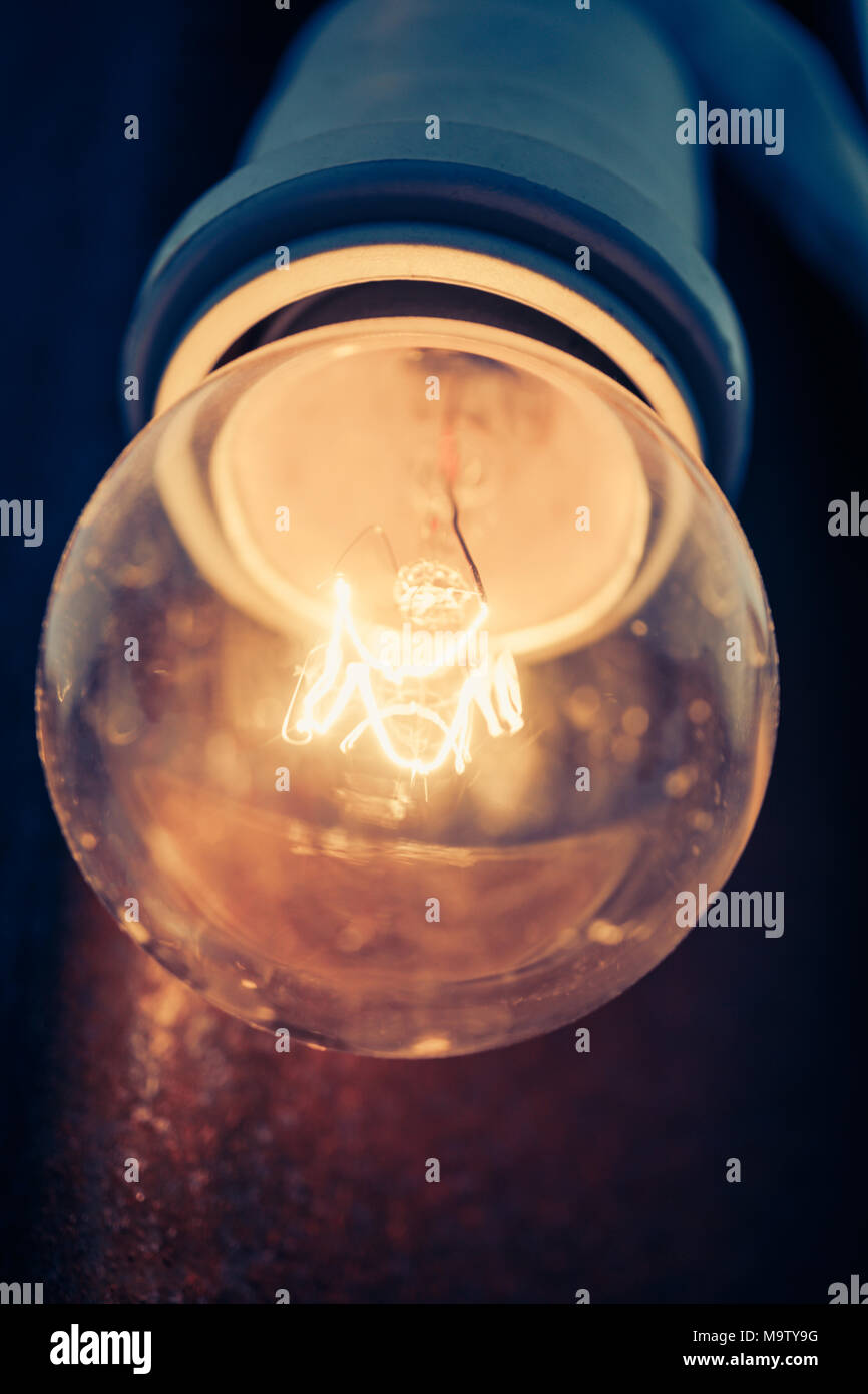 Glowing antique filament light bulb Stock Photo - Alamy