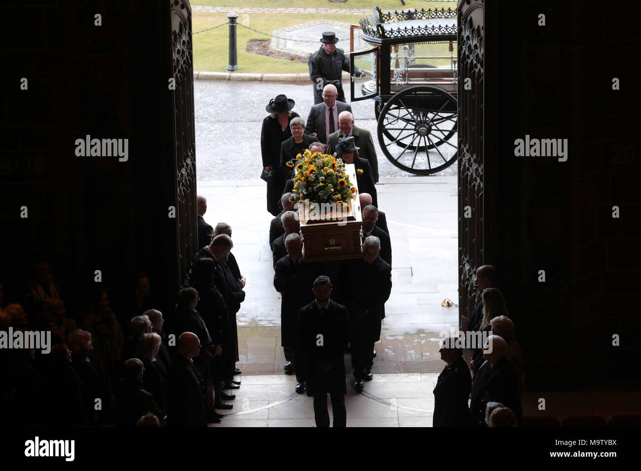 The coffin is carried in during the funeral service of Sir Ken Dodd at ...