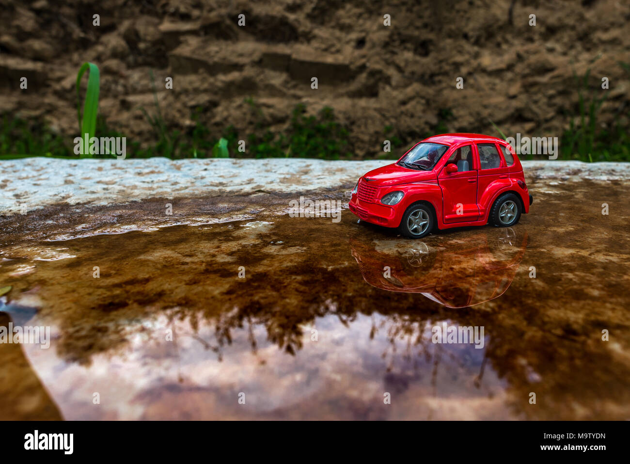 Toy/model car on stone surface Stock Photo - Alamy