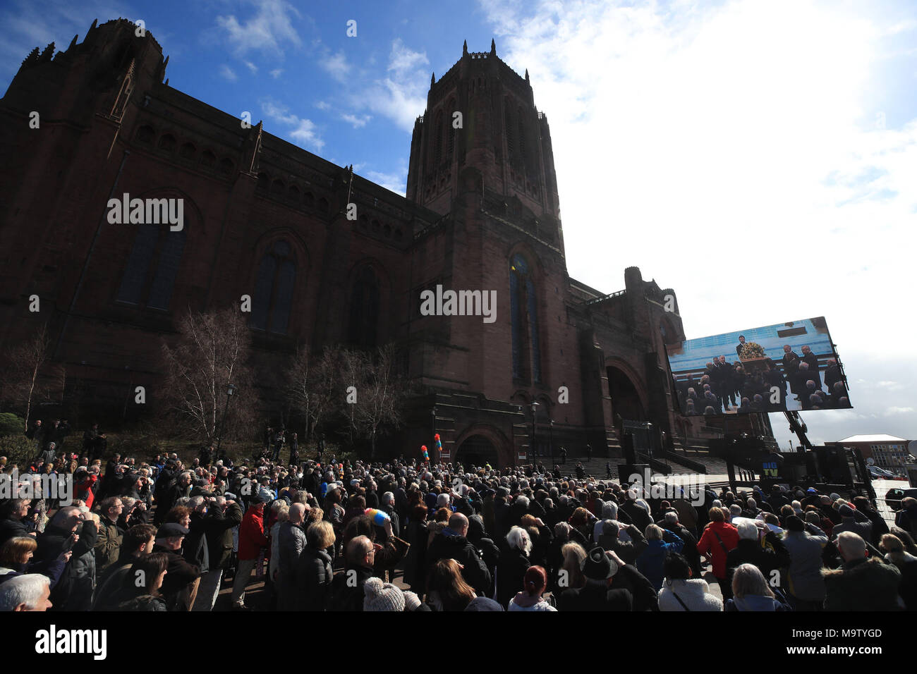 Crowds outside Liverpool Anglican Cathedral watch the funeral service ...