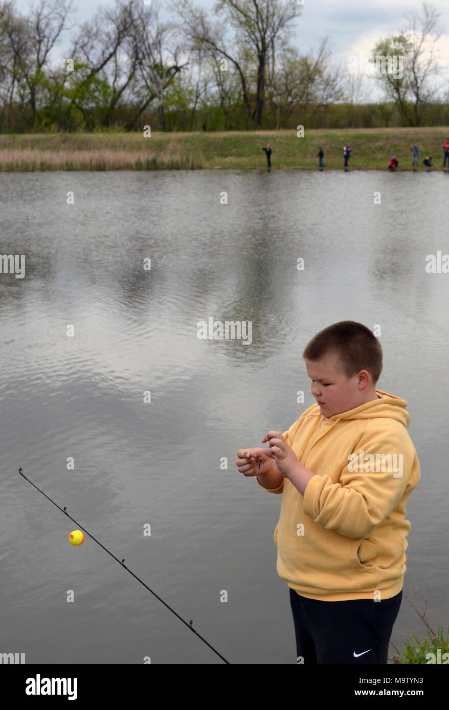 Prepping the worm for fishing. Prepping the worm for fishing Stock ...