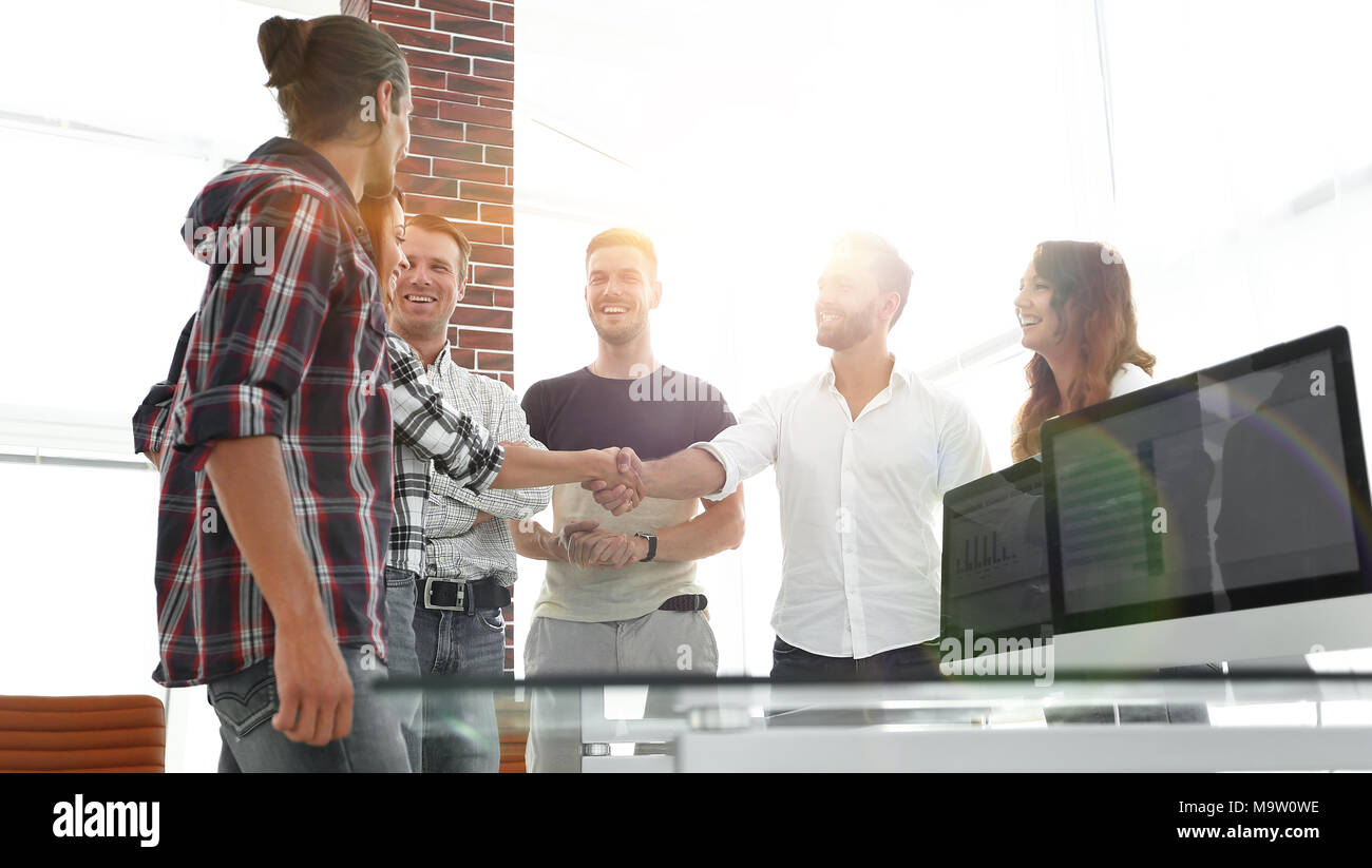 handshake partners in the creative office Stock Photo - Alamy