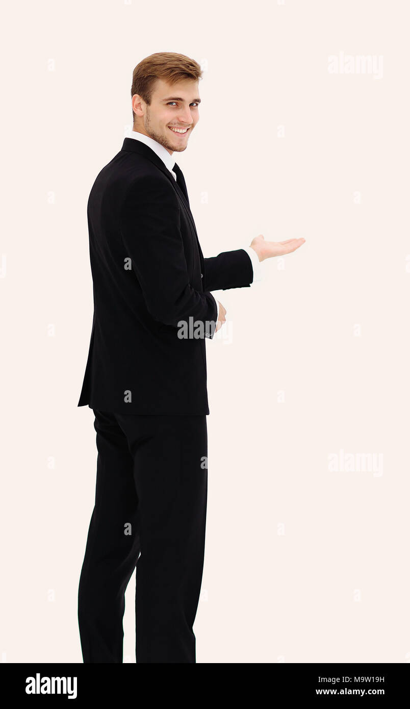 rear view.smiling businessman pointing forward. photo in full gr Stock ...
