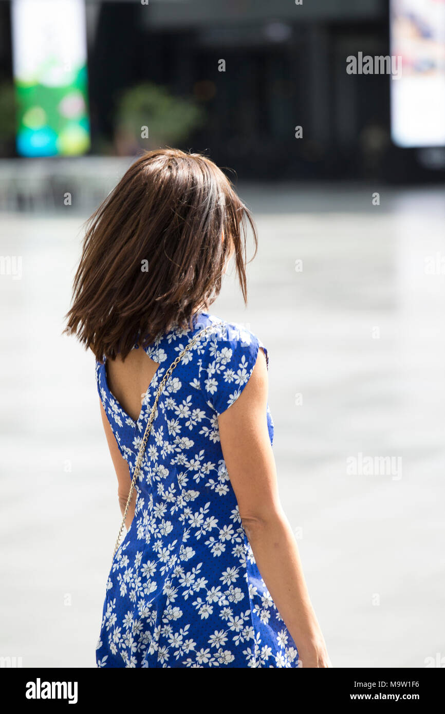 Woman walking back view blur alone hi-res stock photography and images ...