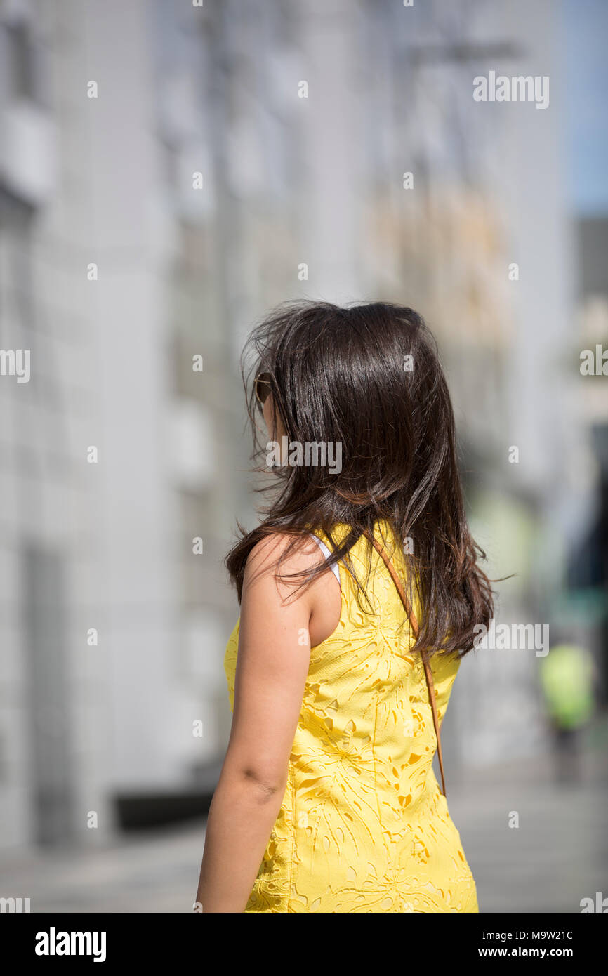 Woman with yellow dress hi-res stock photography and images - Alamy