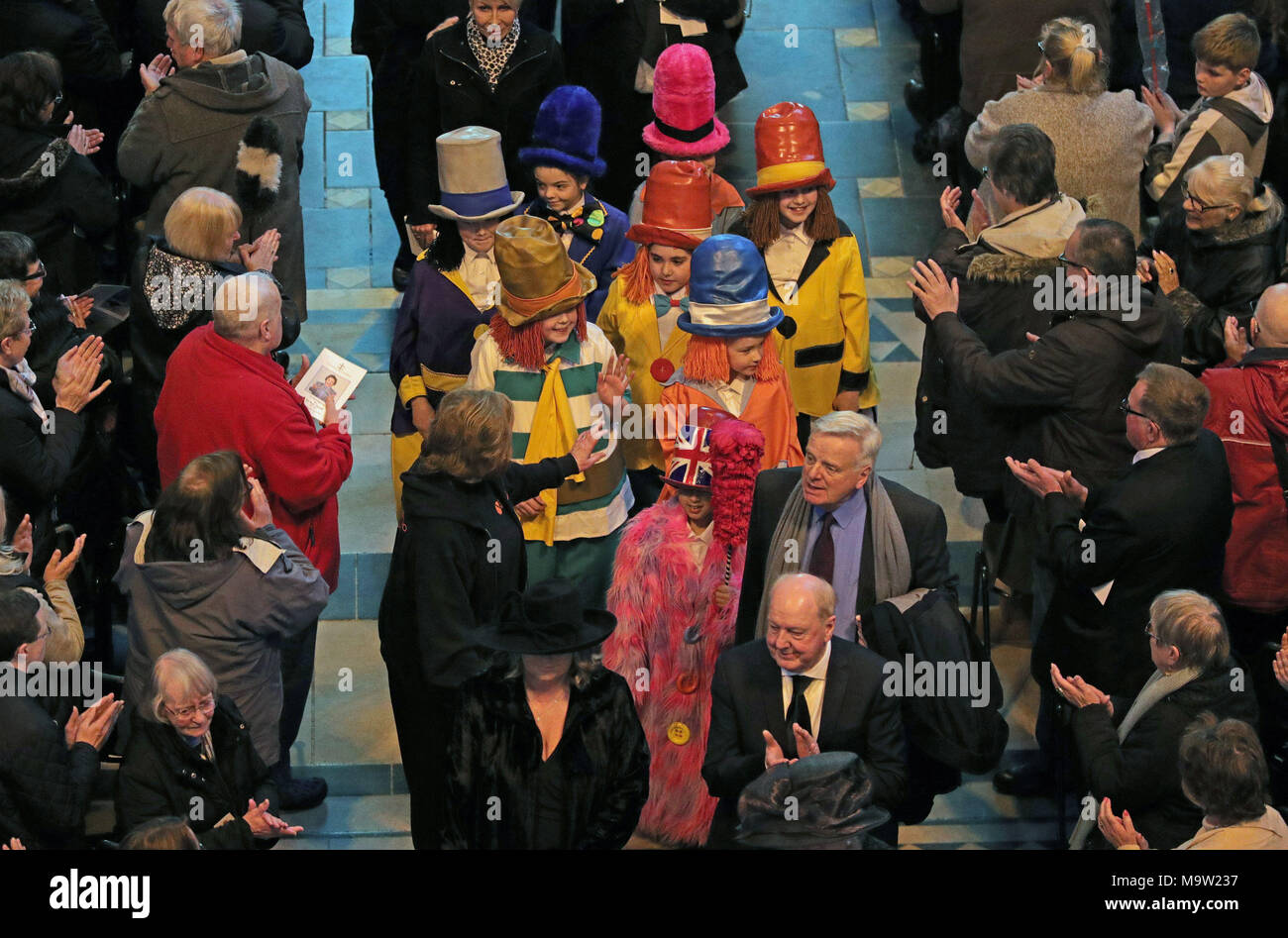 Children dressed as Diddymen follow Sir Ken Dodd's coffin as it is ...