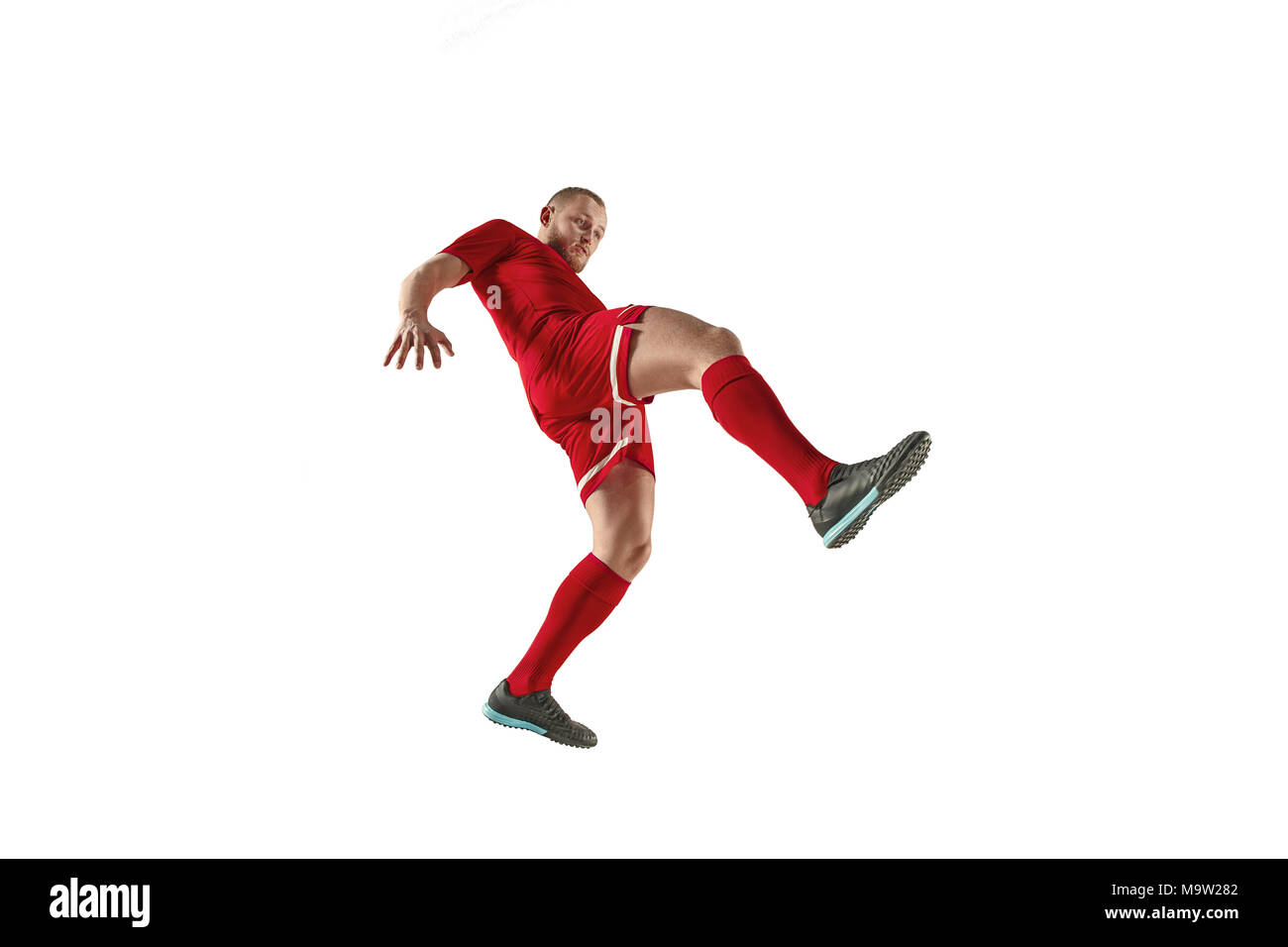 Professional football soccer player in motion isolated on white studio ...
