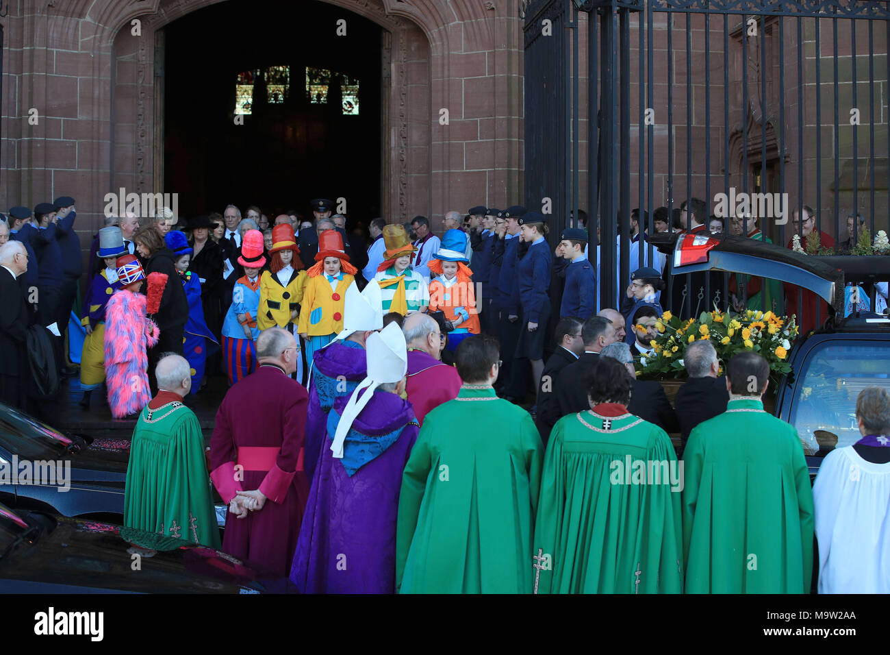 Children dressed as Diddymen watch the funeral cortege leave the ...