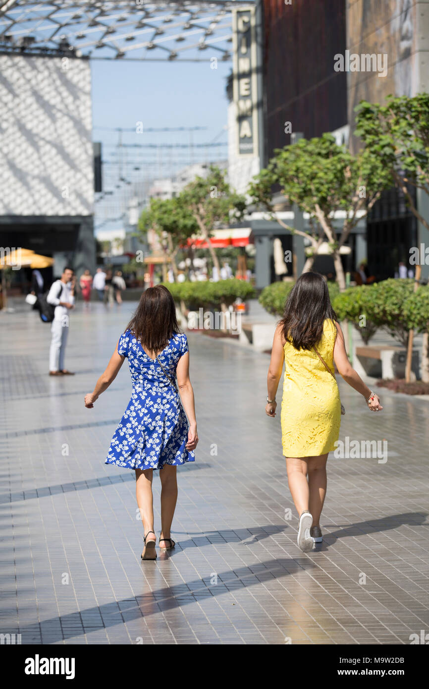 Two female tourists walking at citywalk Dubai UAE Stock Photo - Alamy