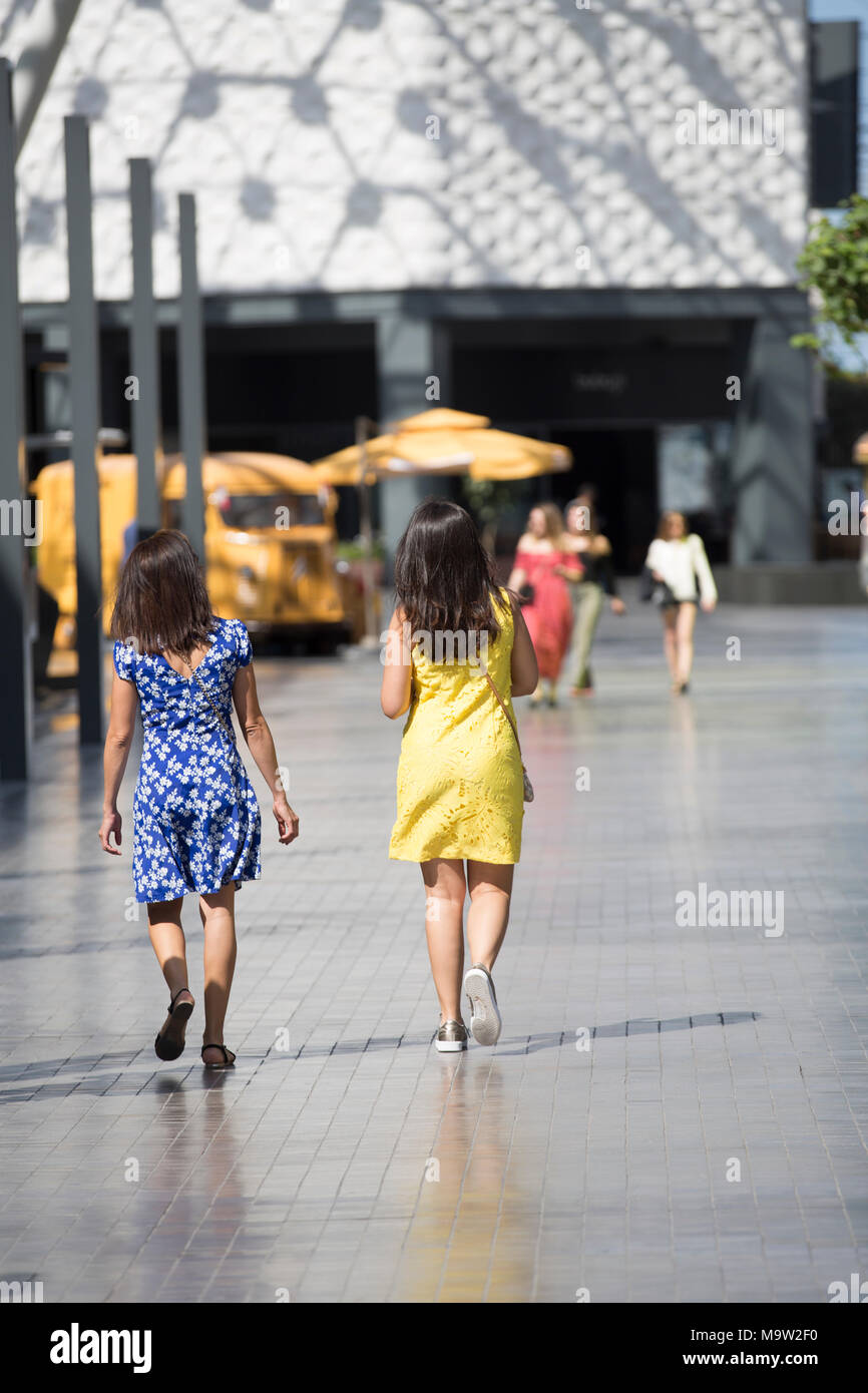 Two female tourists walking at citywalk Dubai UAE Stock Photo - Alamy