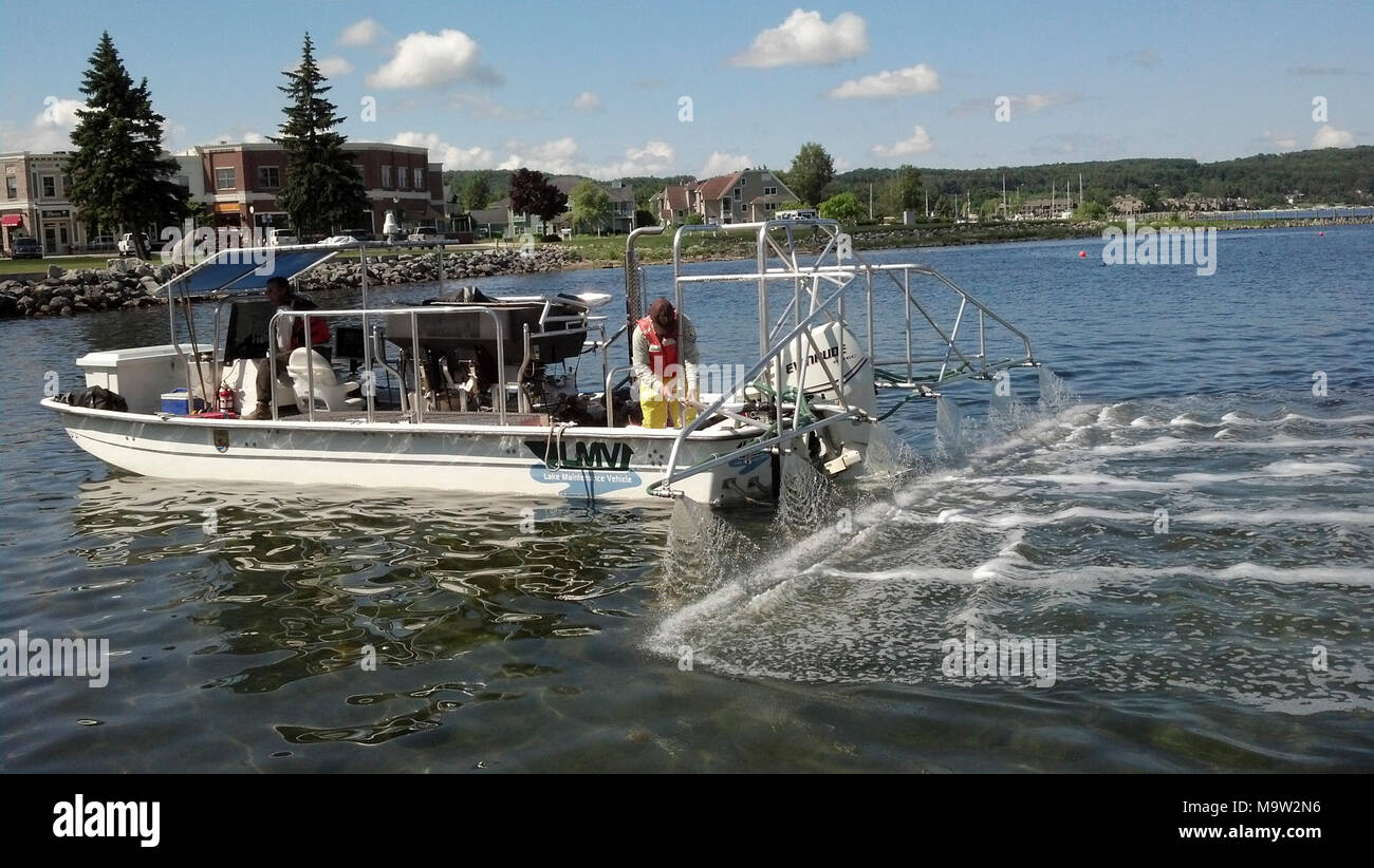 Service Employees Dan Kochanski and Jamie Criger Administer a Granular ...