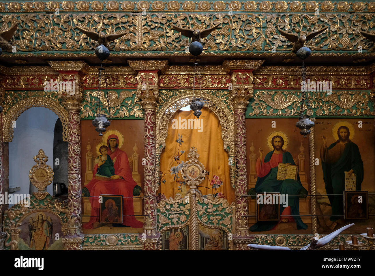 The iconostasis decorated with icons and religious paintings inside the Greek Orthodox Chapel of ...