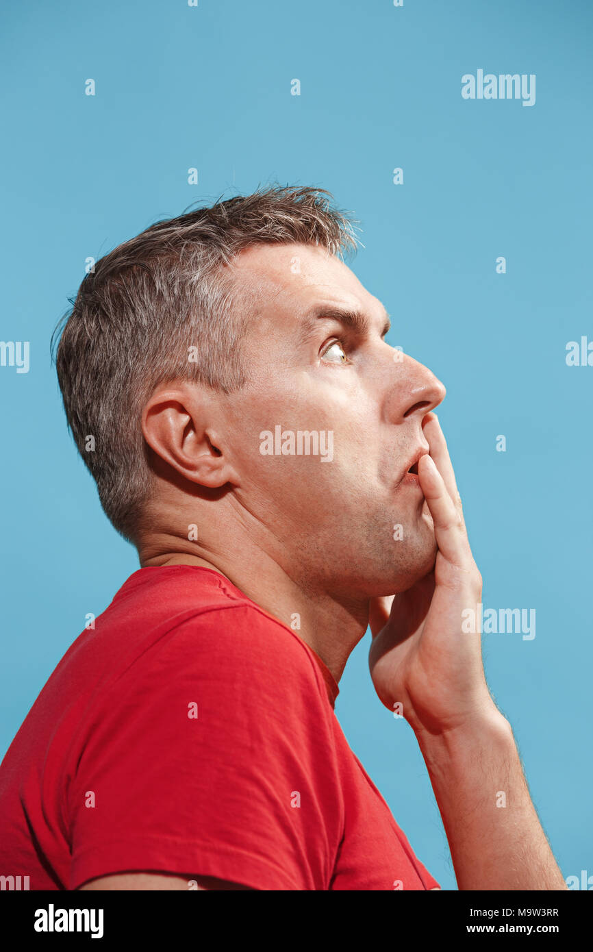 Suspiciont. Doubtful pensive man with thoughtful expression making ...