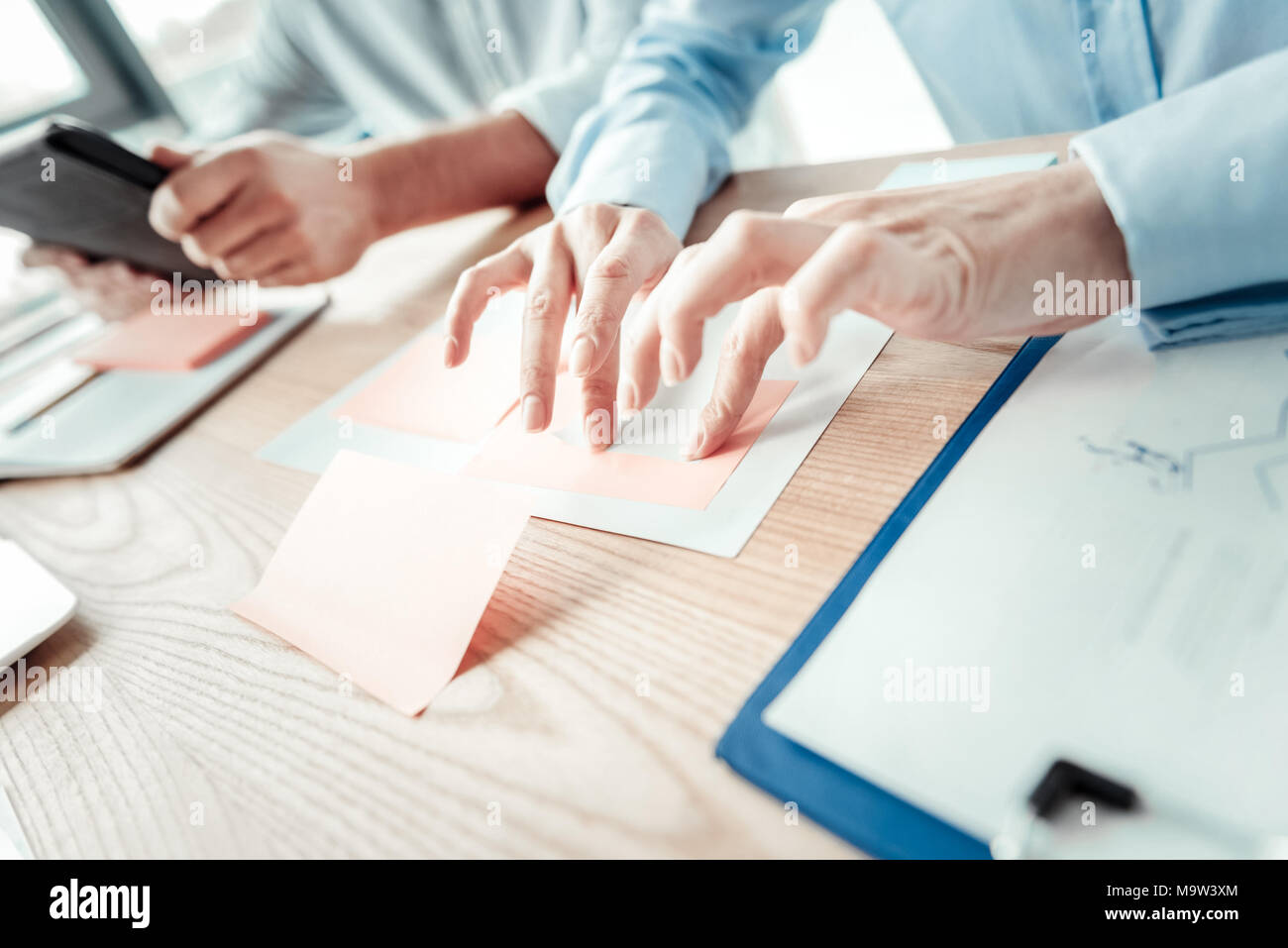 Team work hands touching hi-res stock photography and images - Alamy