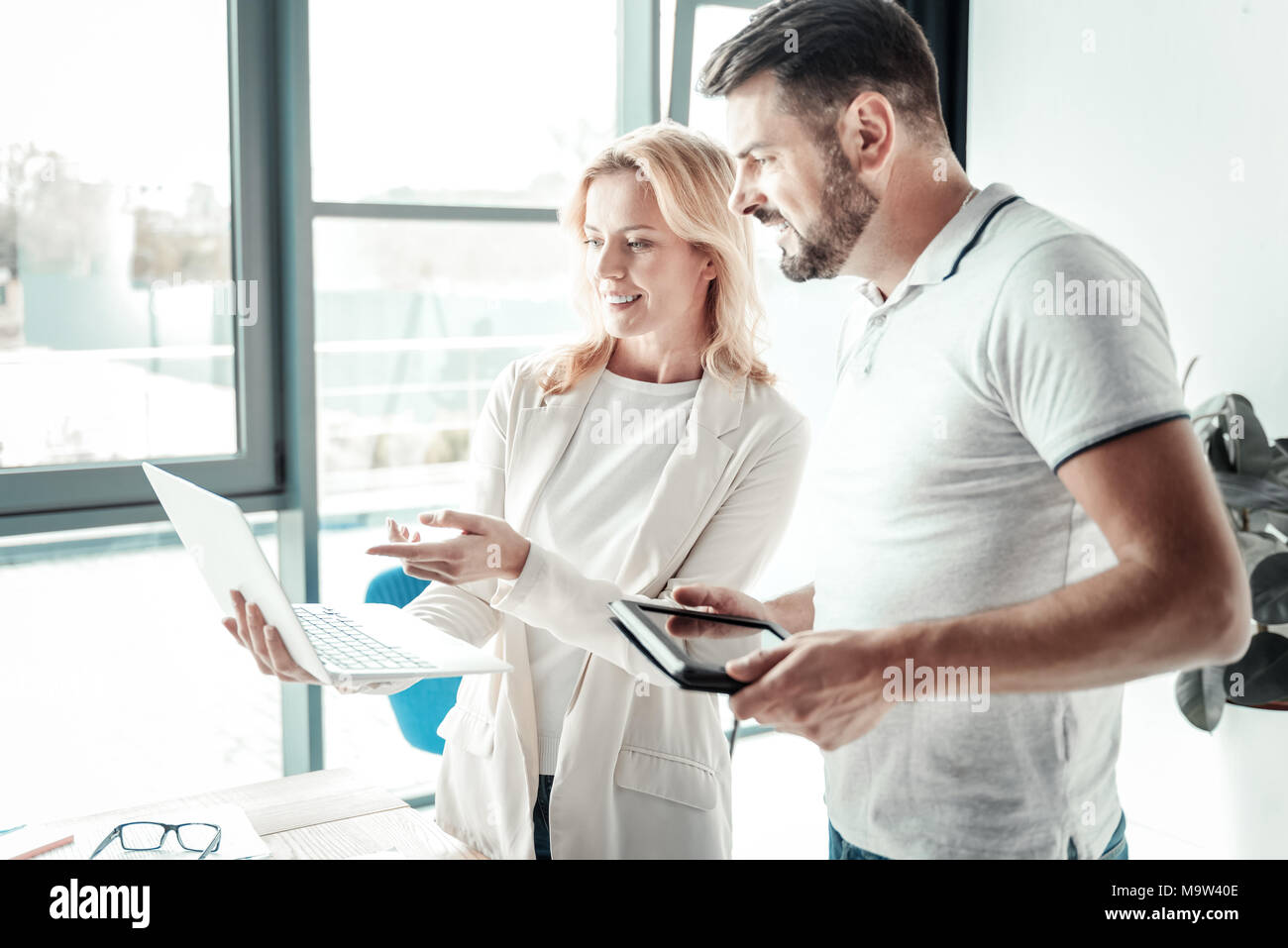 Attentive man listening to his colleague Stock Photo - Alamy