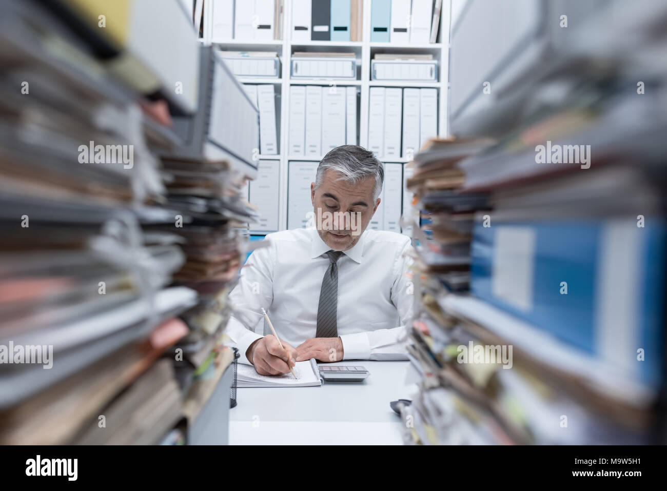 Covered in papers hi-res stock photography and images - Alamy