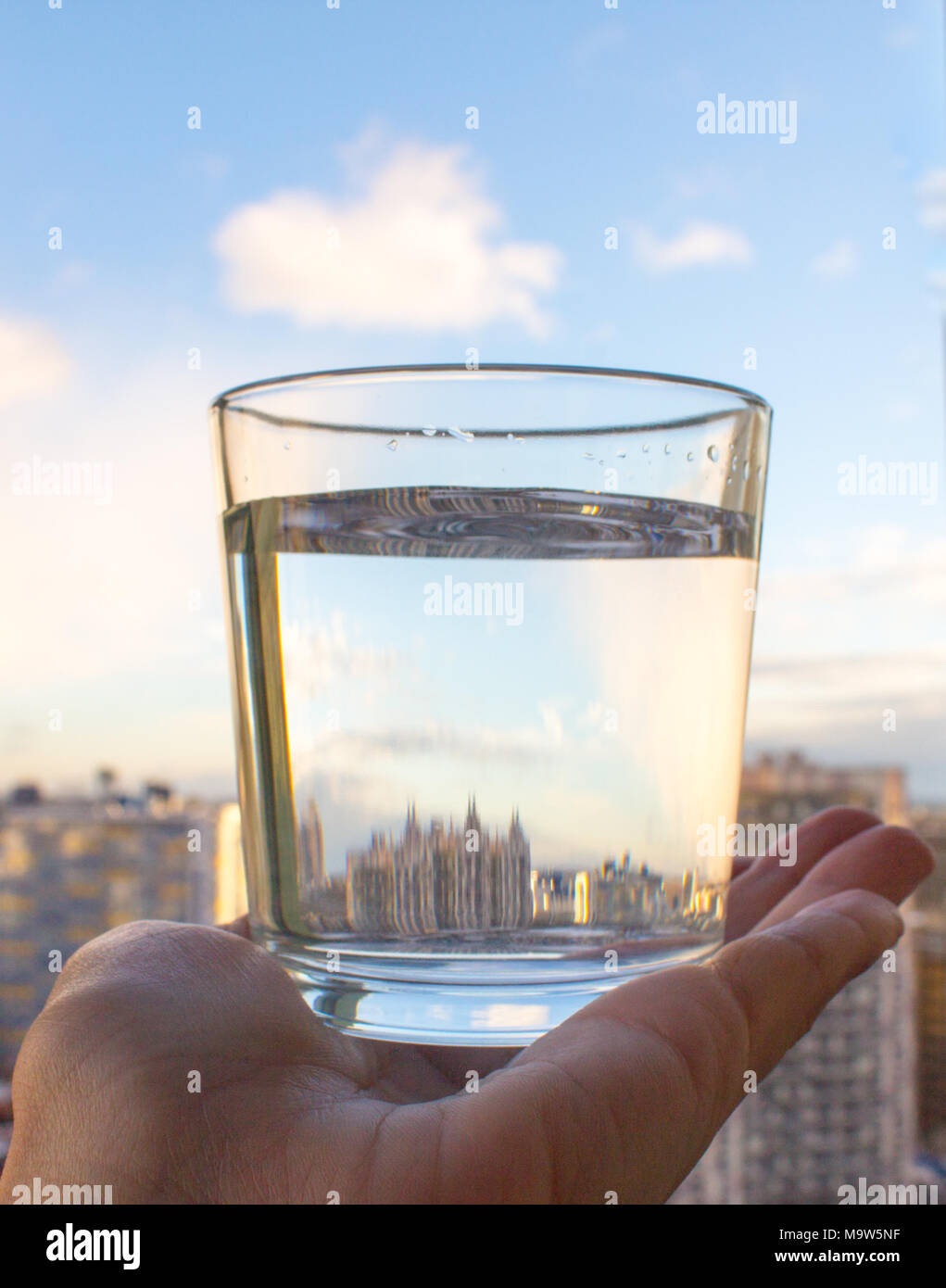 Hand holding glass clear water hi-res stock photography and images - Alamy