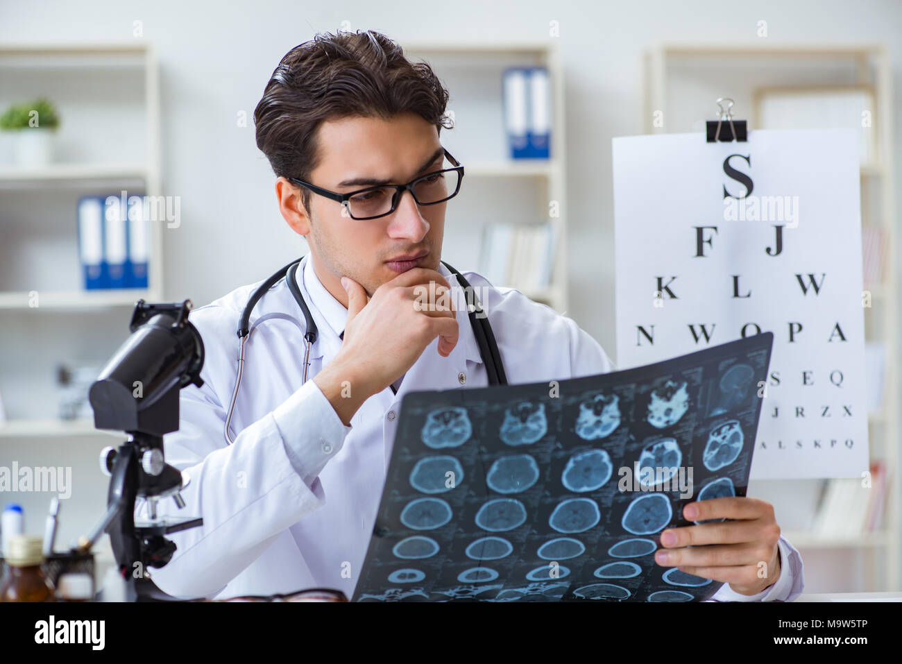 Eye doctor in medical concept Stock Photo - Alamy