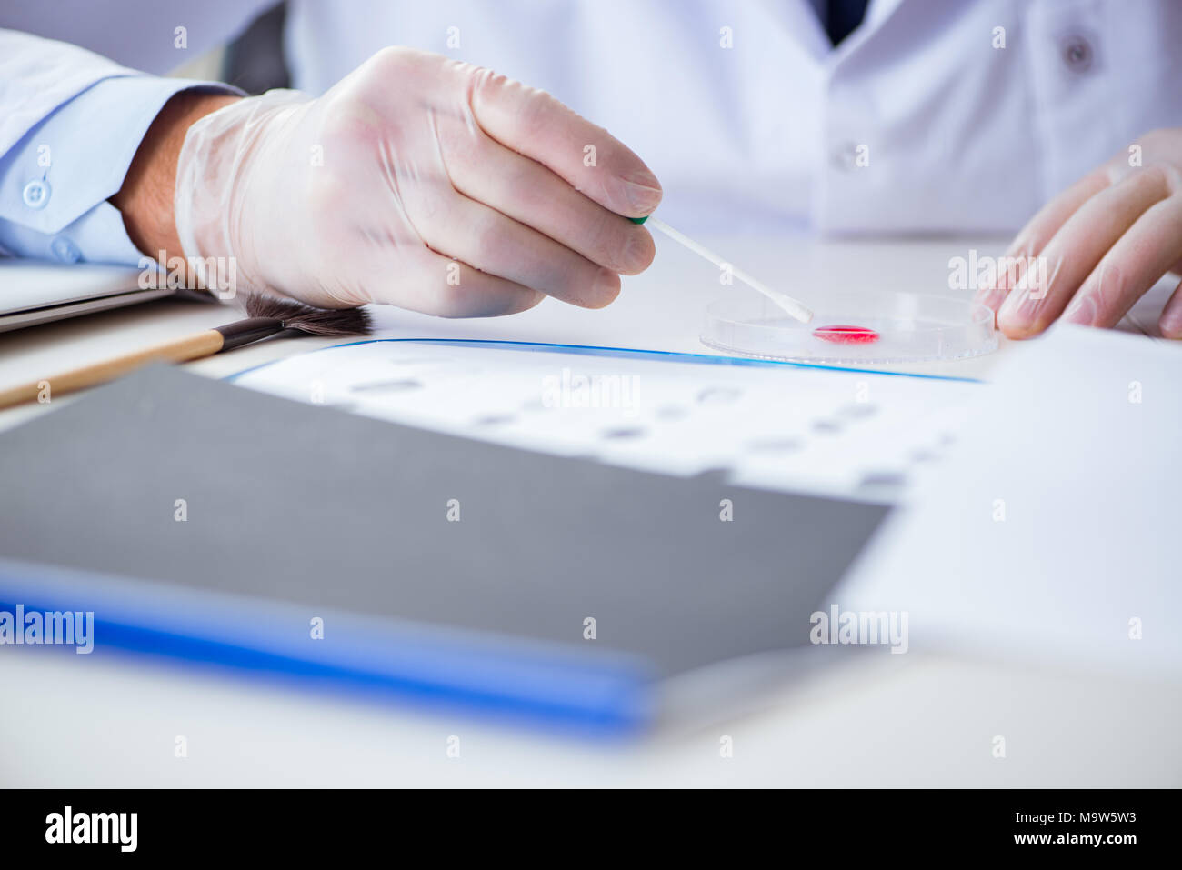 Drug synthesis lab experimentnig with pills Stock Photo - Alamy
