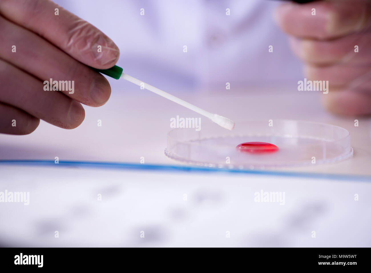 Drug synthesis lab experimentnig with pills Stock Photo - Alamy