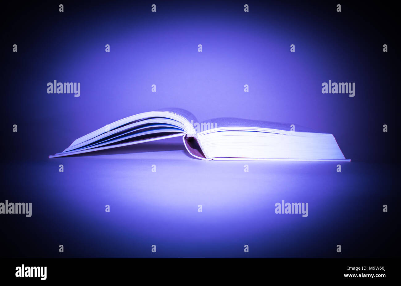 Book with blue background hi-res stock photography and images - Alamy