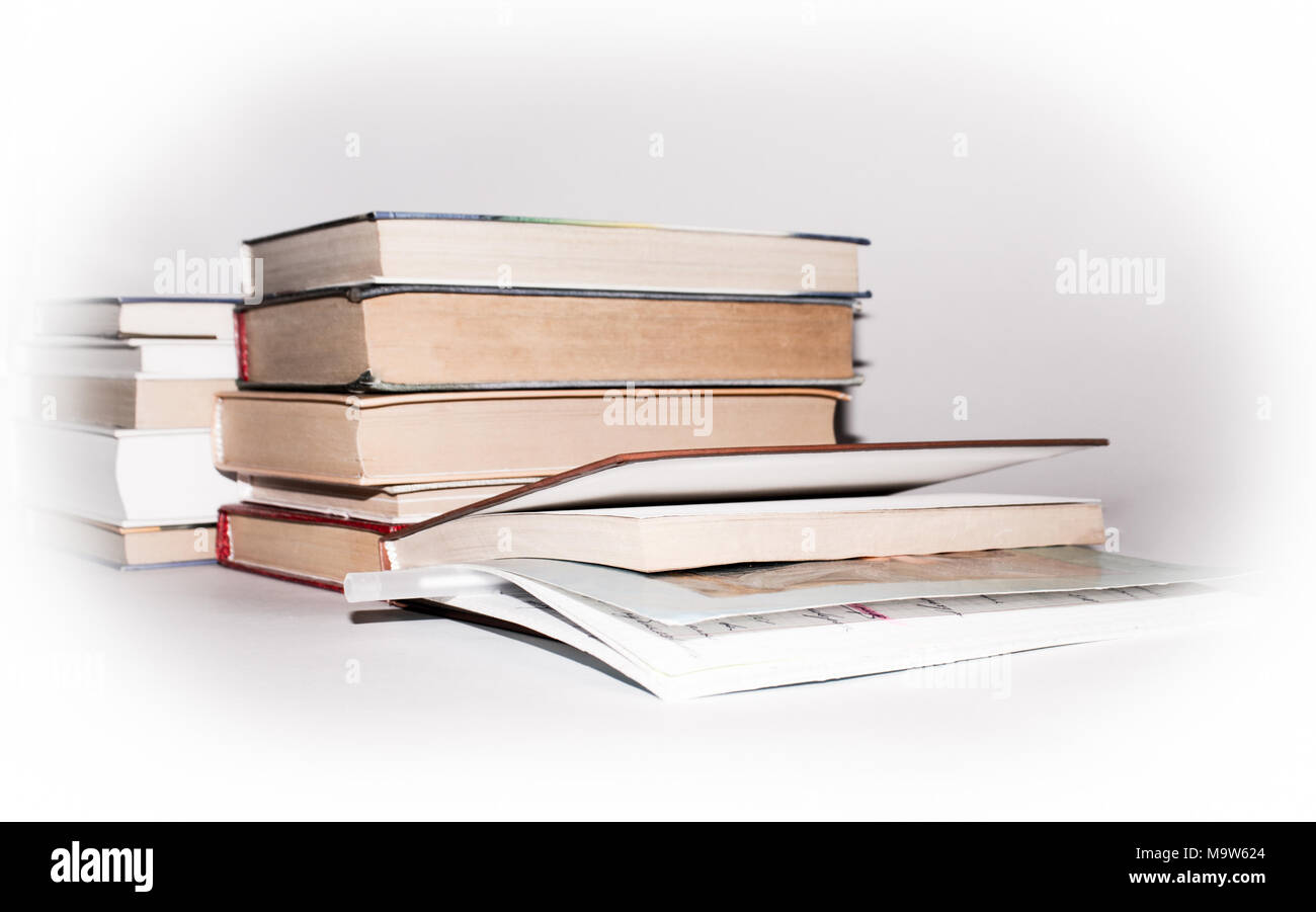Closed book with a pen and notebook Stock Photo - Alamy