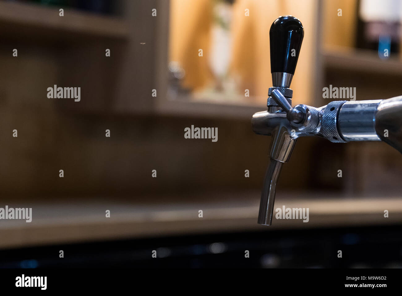 Beer serving machine at bar counter Stock Photo - Alamy