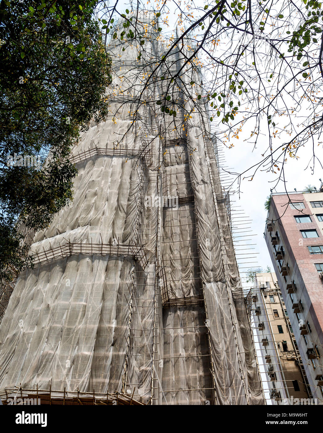 Construction of a tower block using bamboo scaffolding in Hong Kong ...