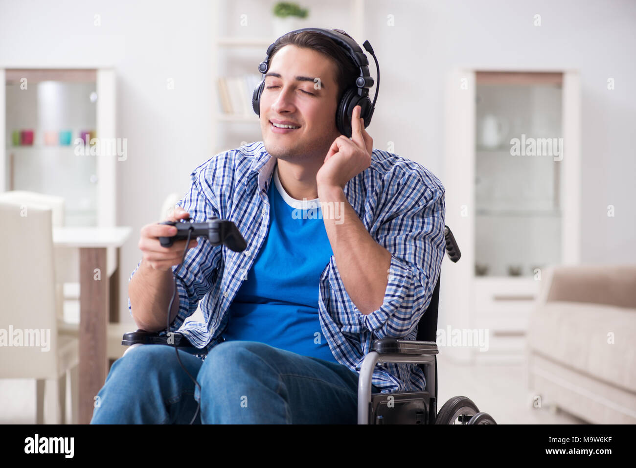 Disabled man playing computer games during rehabilitation Stock Photo ...