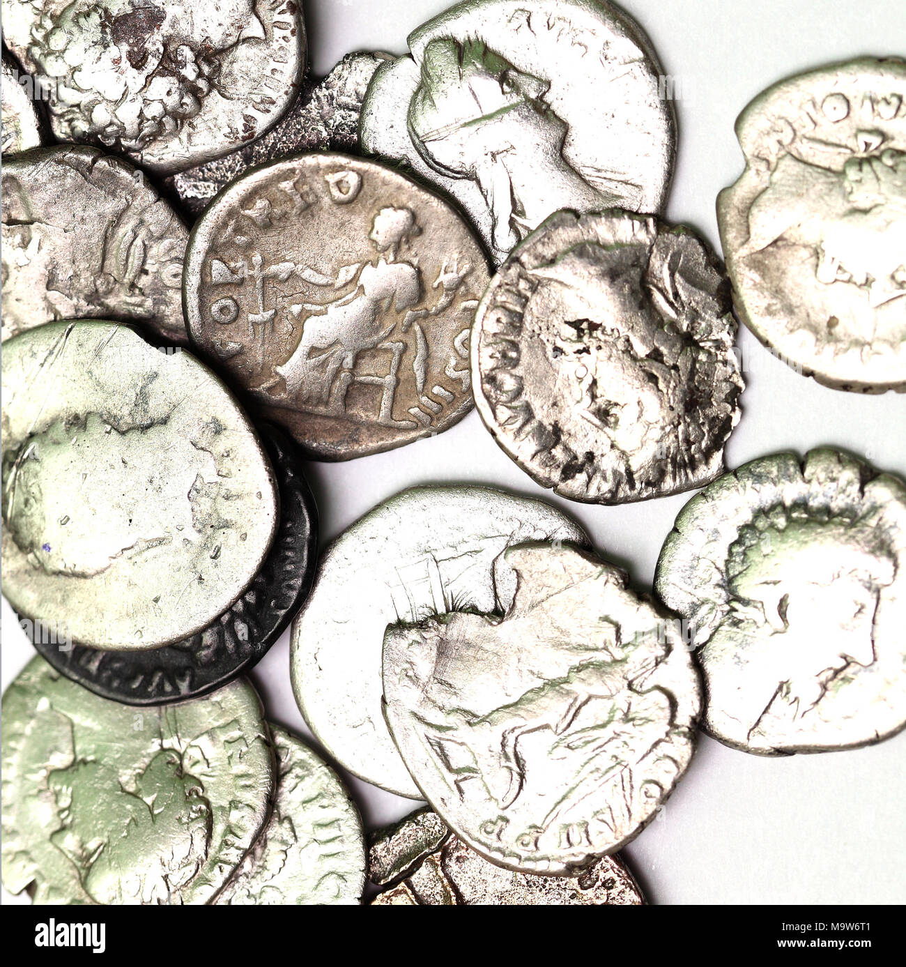 Old roman coins on a white background. Denaria Stock Photo - Alamy