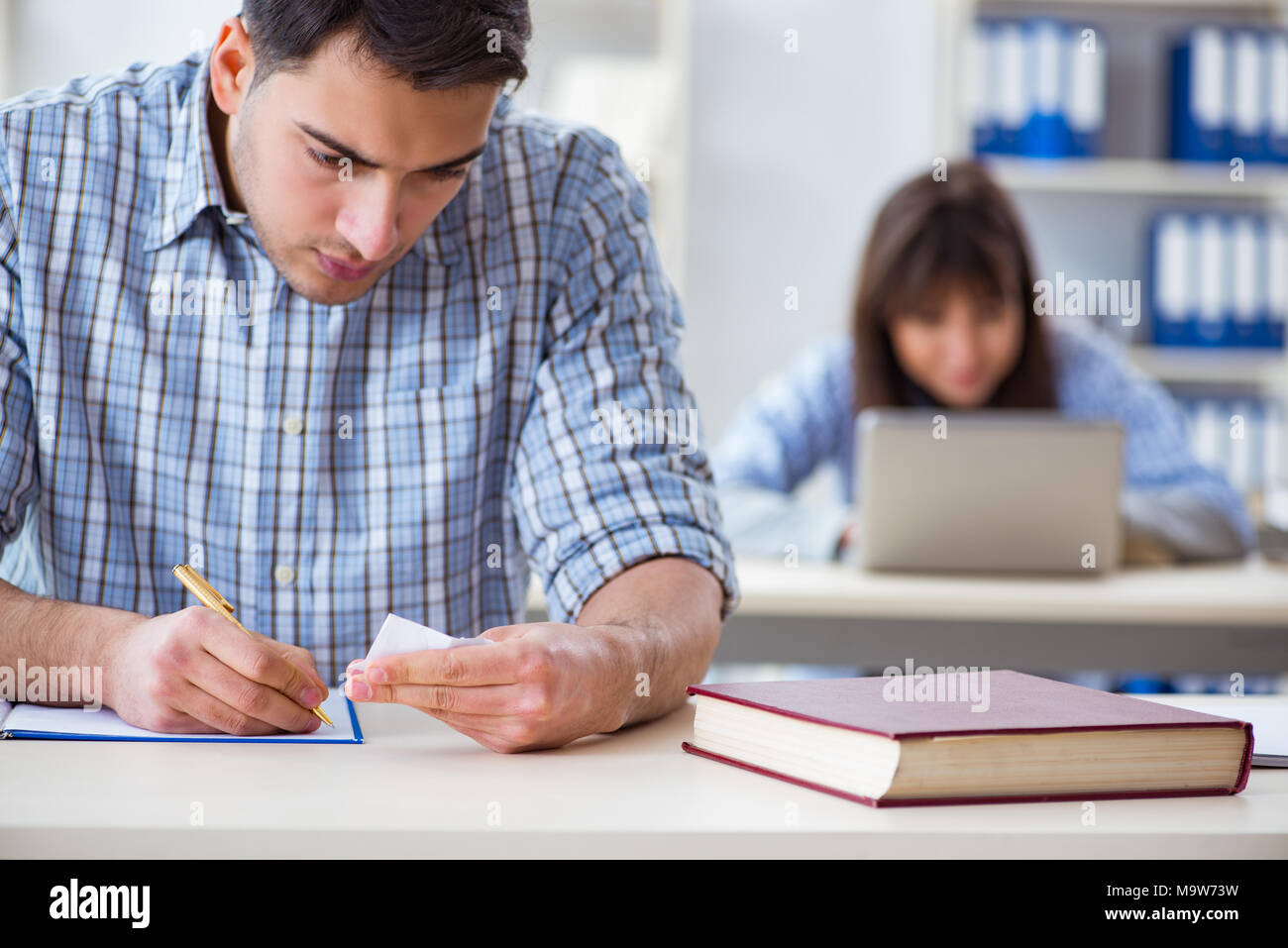 Students sitting and studying in classroom college Stock Photo - Alamy