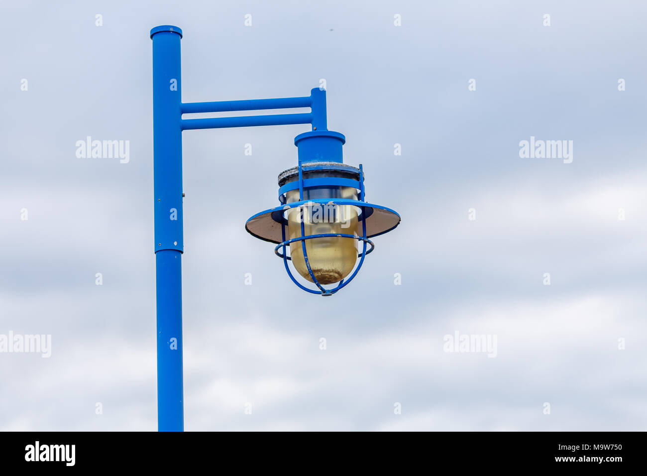 blue metal street lamp on sky background Stock Photo - Alamy