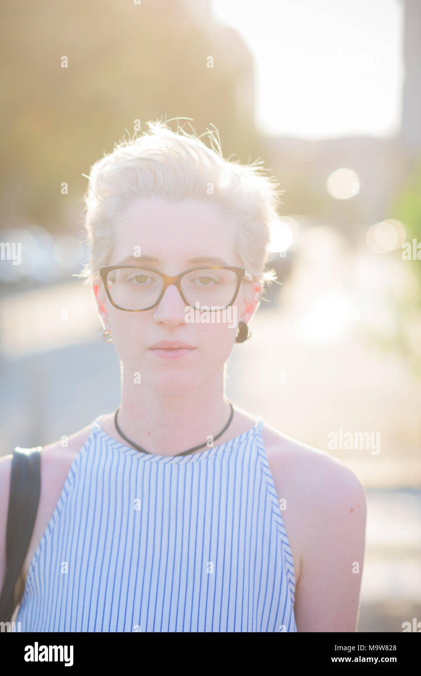 portrait young woman outdoor looking camera serene - creative people ...