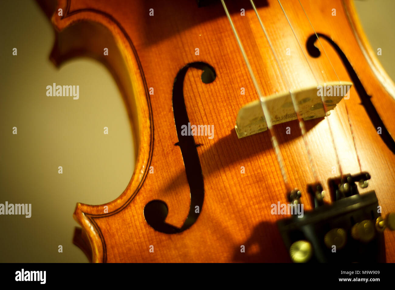 Baroque Violin - Yellow background Stock Photo - Alamy