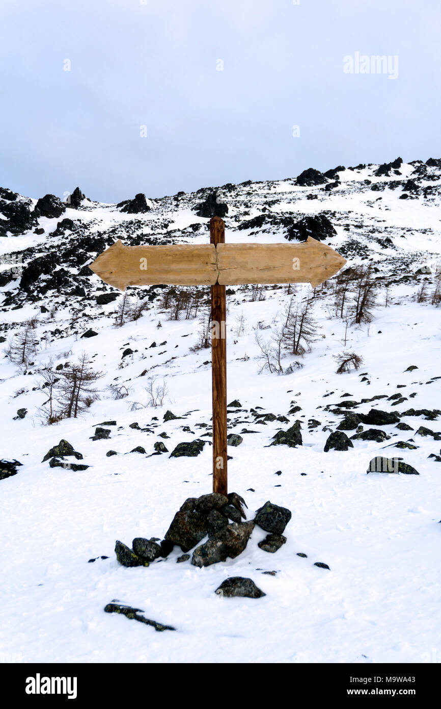 Wooden signpost with arrows in two directions hi-res stock photography ...