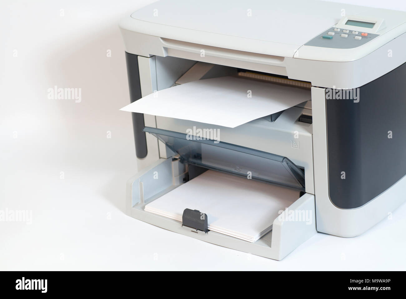 Printer with paper isolated on white background Stock Photo - Alamy
