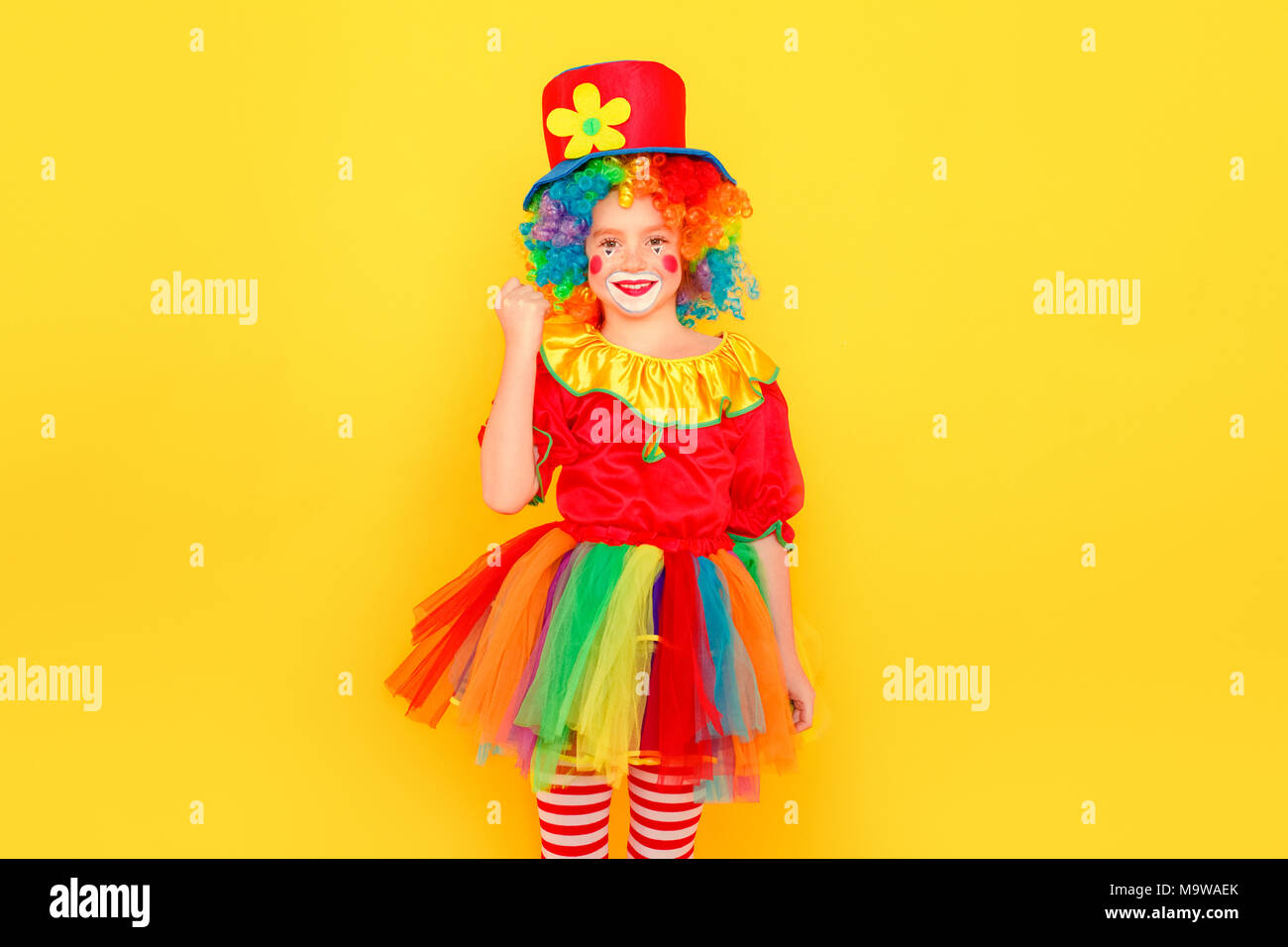 Yes! Cute little girl in carnival costume celebration victory Stock ...