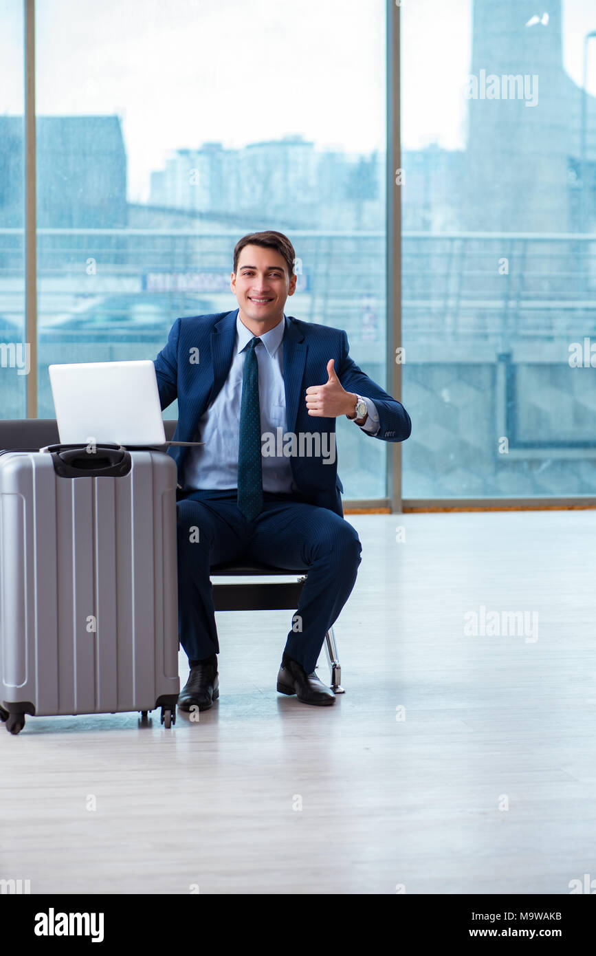 Businessman waiting at the airport for his plane in business class Stock Photo - Alamy