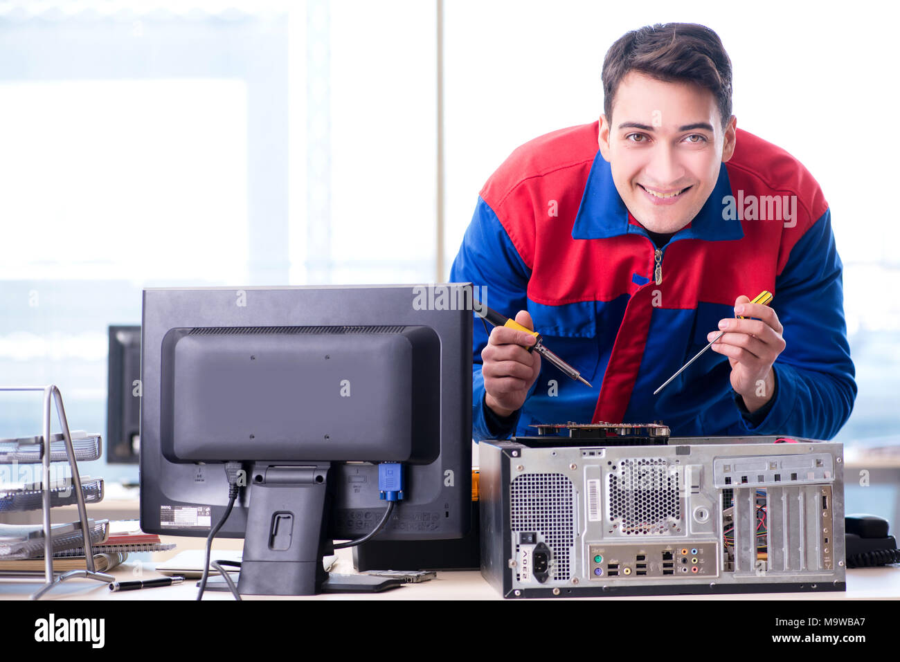 Computer repairman specialist repairing computer desktop Stock Photo ...