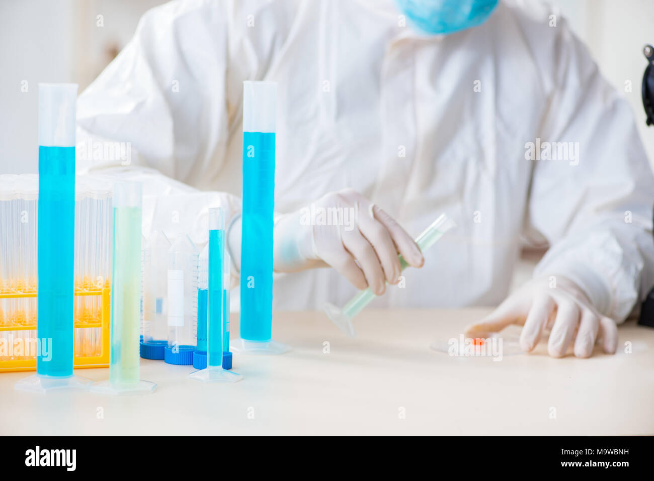 Lab assistant in drug synthesis concept Stock Photo - Alamy