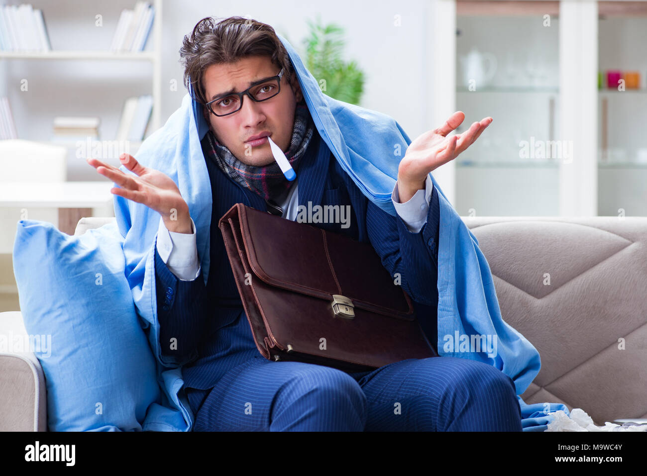 Sick employee staying at home suffering from flue Stock Photo - Alamy