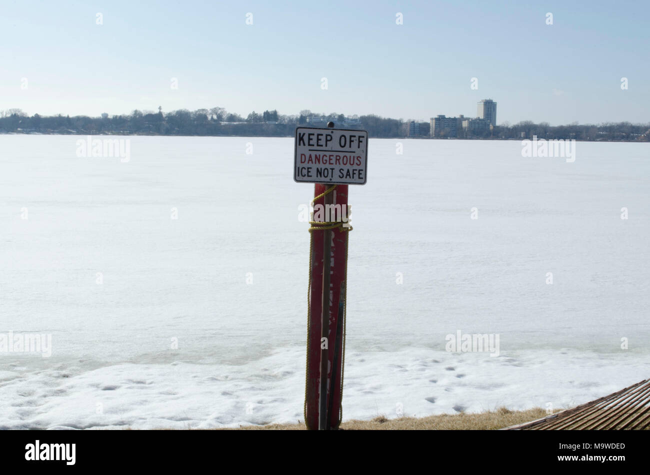 Dangerous Ice Sign on Frozen Lake Stock Photo - Alamy