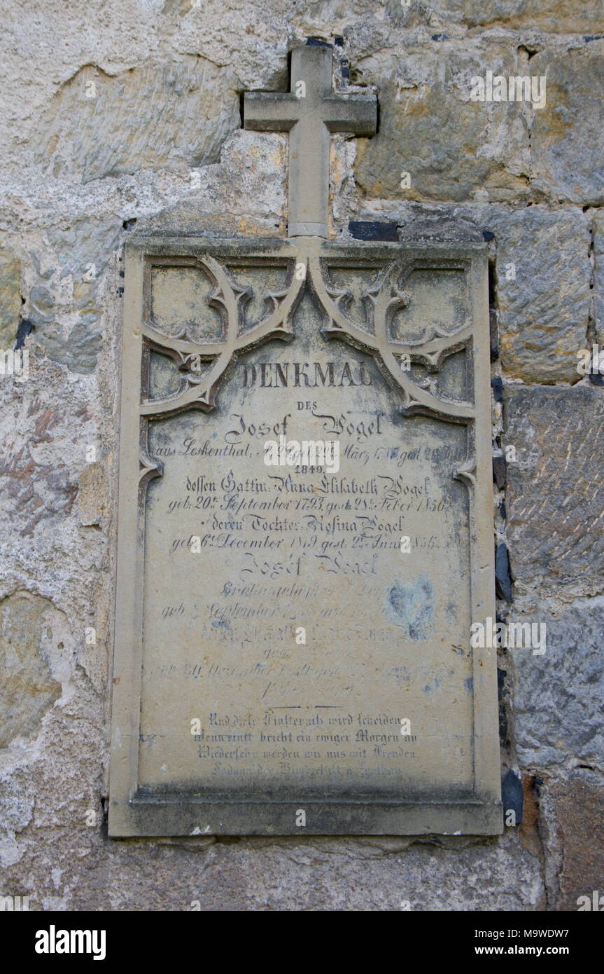 Old gravestone on the wall of a neglected church in Dobranov near Ceska ...