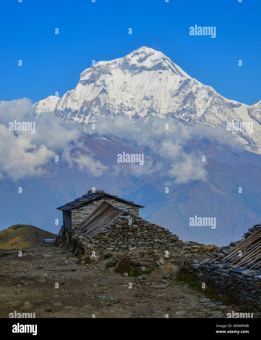 Mountain houses with snow peak of Annapurna Range in Khopra, Nepal ...