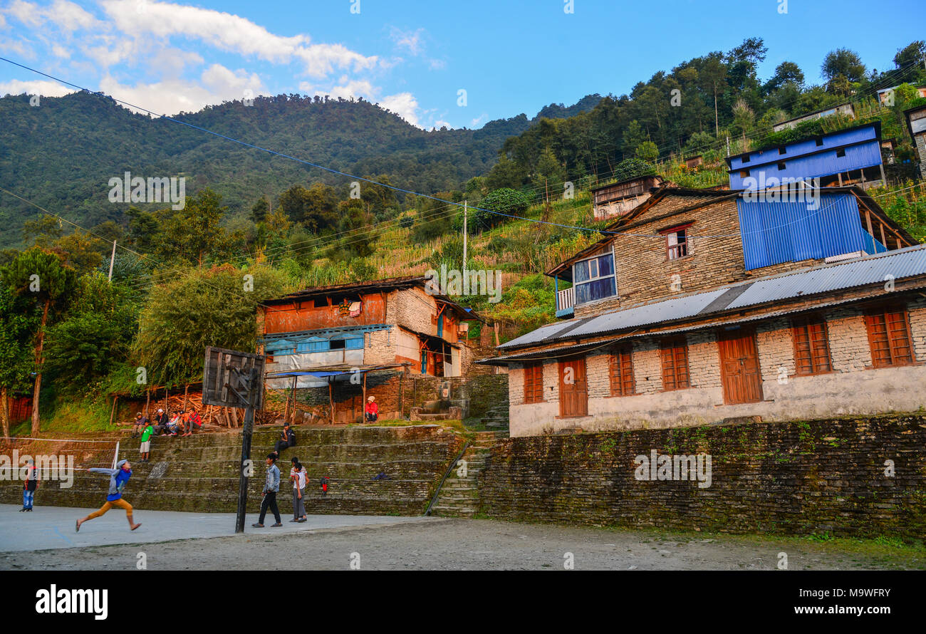 Ghara, Nepal - Oct 25, 2017. People playing on main square of Paudwar ...