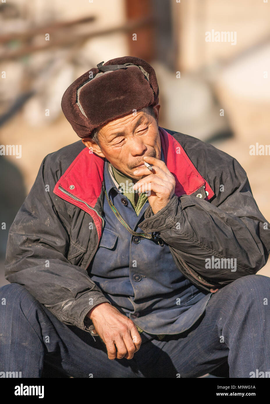 BEIJING-DEC. 23, 2010. Chinese smokes a cigarette. China is the world's ...