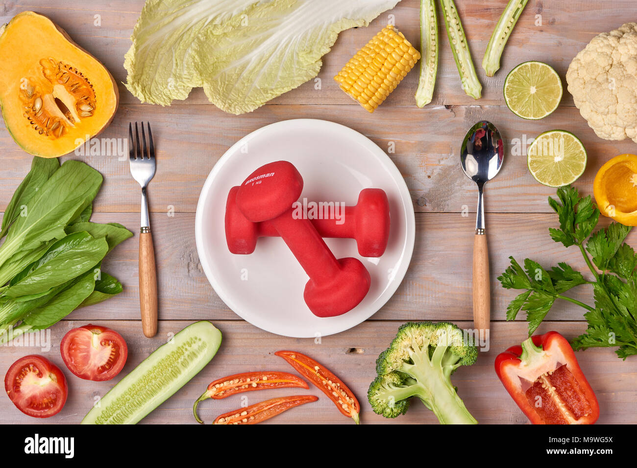 Food and sheet of paper with a diet plan on a dark wooden table ...