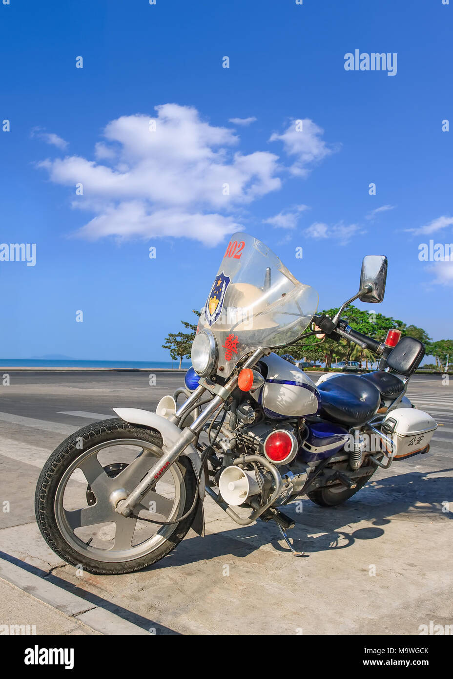 SANYA-JAN. 13, 2012. Police motorbike parked on a boulevard ...